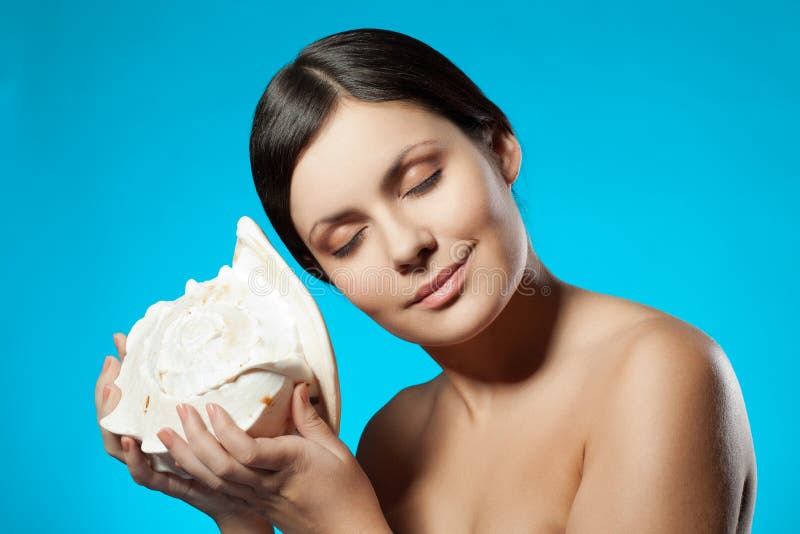 Woman holding seashell stock image. Image of lifestyle - 22911543