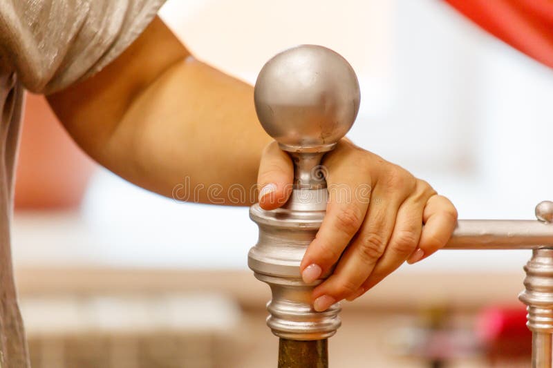 A Woman is Holding a Silver Knob with Her Hand Stock Photo - Image of ...
