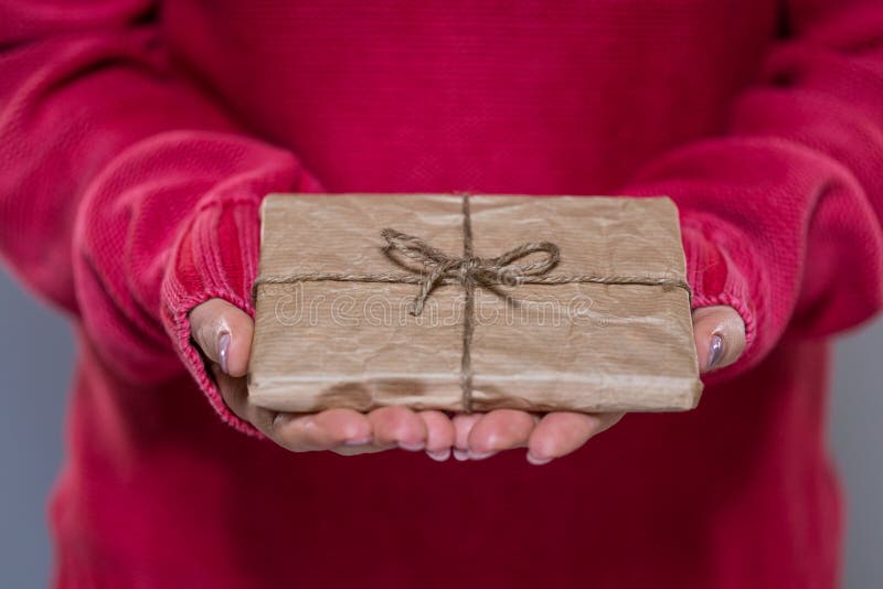 Woman Holding a Small Package Stock Image - Image of sweater, woman ...