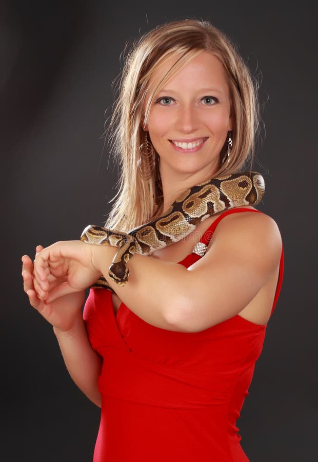 Woman holding a snake stock photo. Image of blond, isolated - 15407706