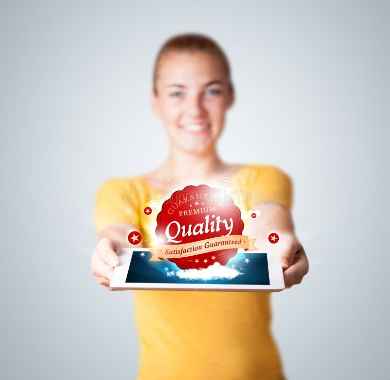 Woman Holding Tablet with Red Quality Label in Clouds Stock Photo ...