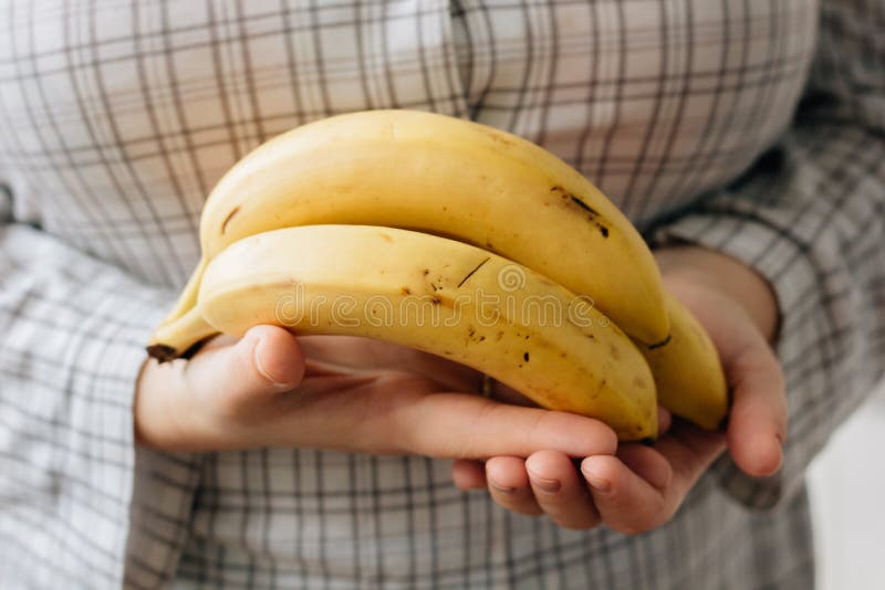 Woman Holding Three Ripe Bananas in Arms Stock Image - Image of healthy ...