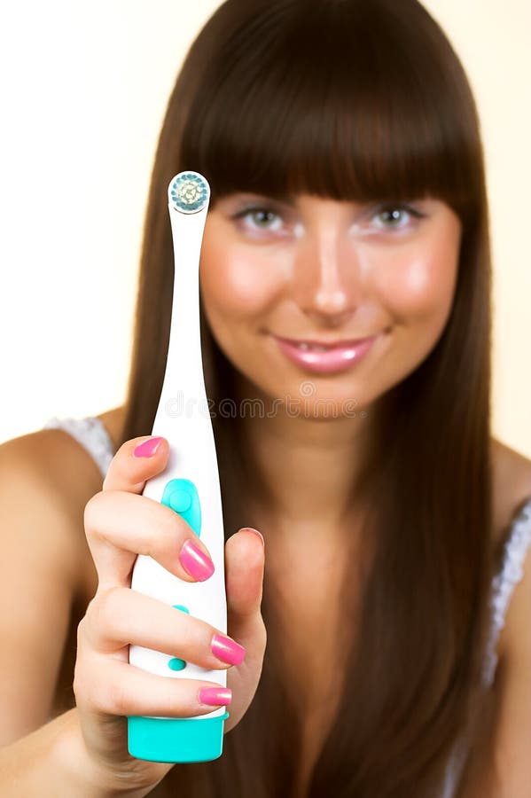Woman holding a toothbrush stock image. Image of beautiful - 5314079