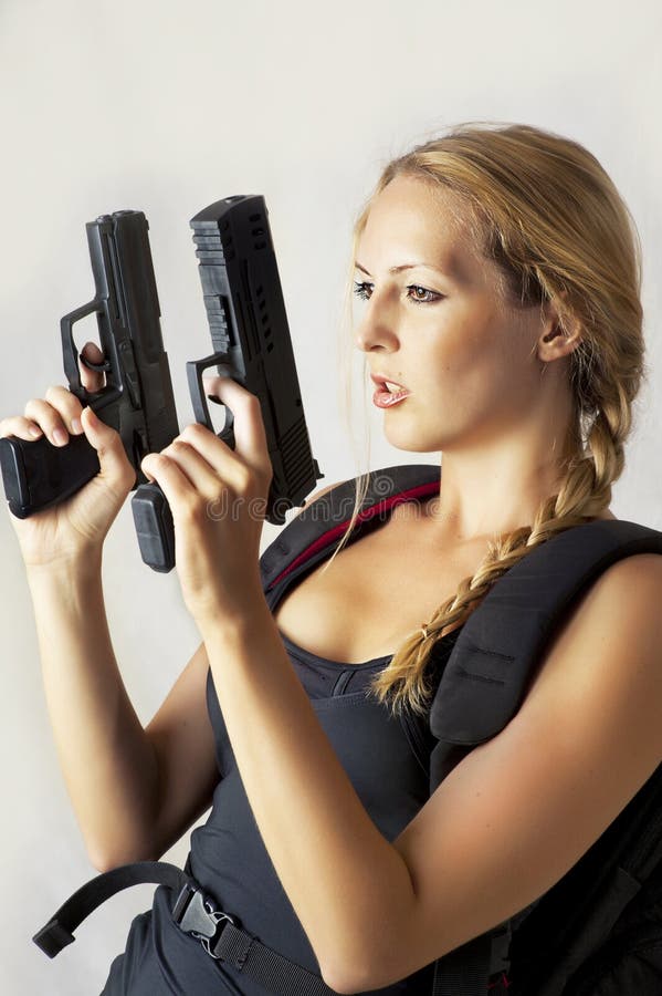 Woman holding two hand gun stock photo. Image of fantasy - 25642726