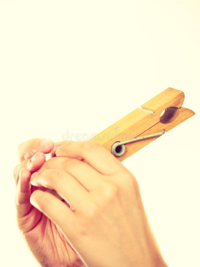 Woman holds big clothespin stock photo. Image of woman - 197748600
