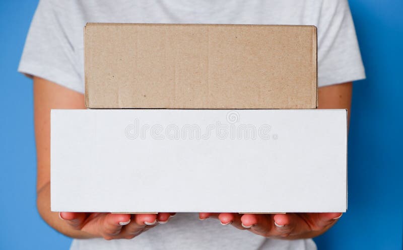 A Woman Holds Boxes in Her Hands. Close-up Stock Photo - Image of hand ...