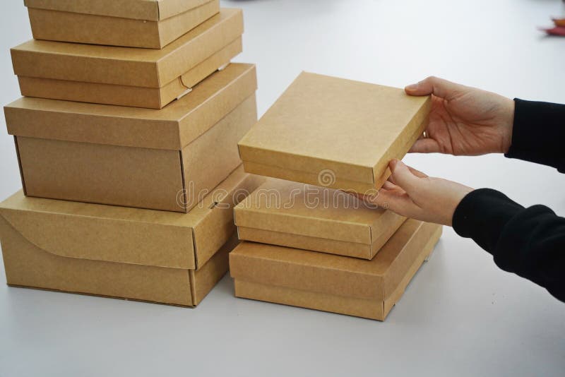 A Woman Holds Cardboard Boxes for Parcels and Delivery Stock Image ...