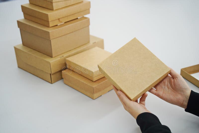 A Woman Holds Cardboard Boxes for Parcels and Delivery Stock Image ...