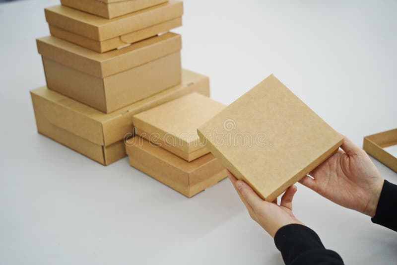 A Woman Holds Cardboard Boxes for Parcels and Delivery Stock Image ...