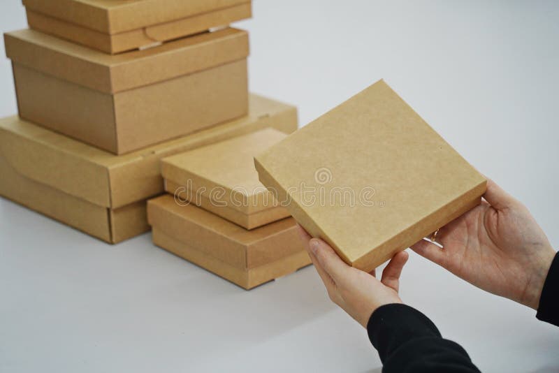 A Woman Holds Cardboard Boxes for Parcels and Delivery Stock Image ...