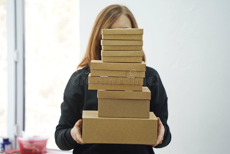 A Woman Holds Cardboard Boxes for Parcels and Delivery Stock Image ...
