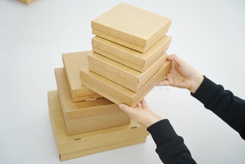 A Woman Holds Cardboard Boxes for Parcels and Delivery Stock Photo ...