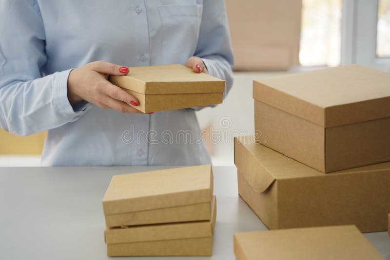 A Woman Holds Cardboard Boxes for Parcels and Delivery Stock Image ...