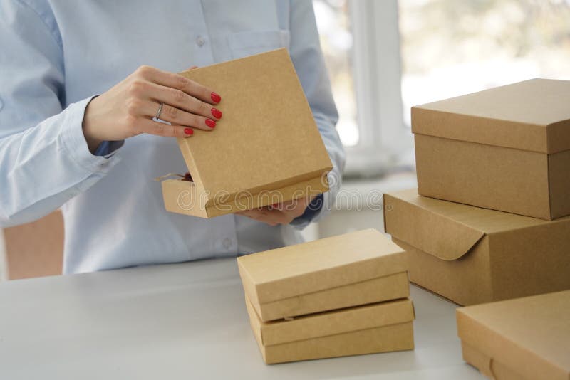 A Woman Holds Cardboard Boxes for Parcels and Delivery Stock Image ...