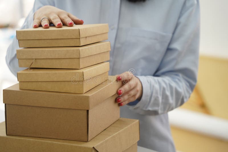 A Woman Holds Cardboard Boxes for Parcels and Delivery Stock Image ...