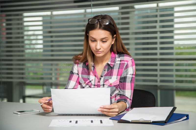 Woman Holds Document and Carefully Study it Stock Image - Image of ...