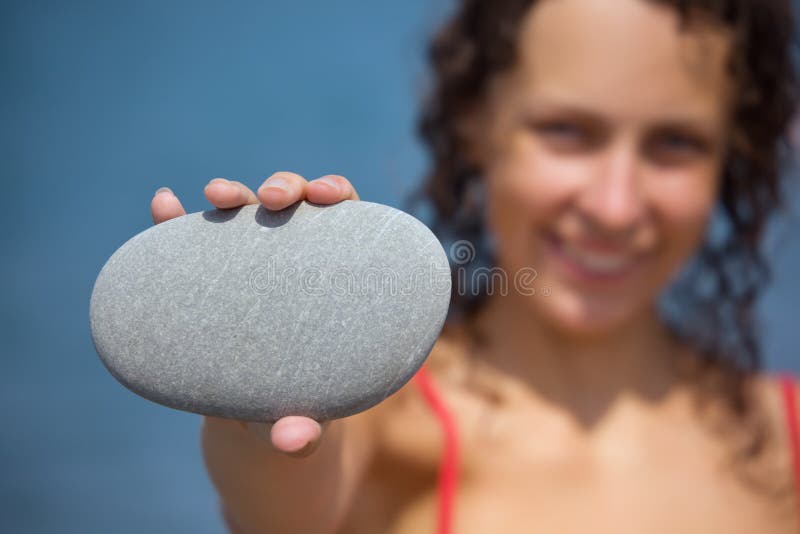 Woman Holds in Hand Pebble, Focus on Pebble Stock Photo - Image of ...