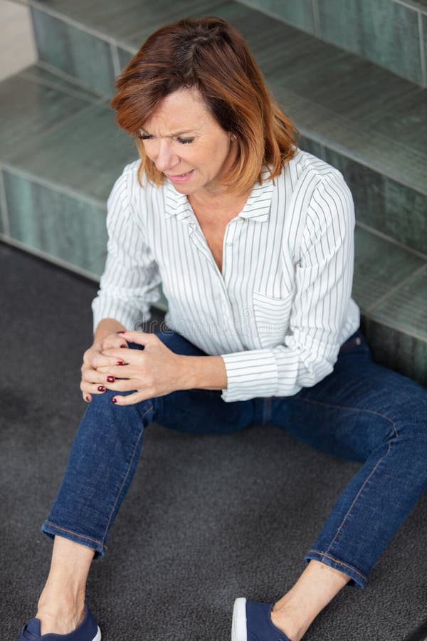 Woman Holds Leg after Falling Down Stairs Stock Photo - Image of hurt ...