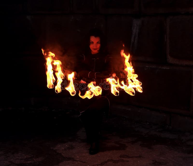 Woman Holds in His Hand the Fire Stock Photo - Image of flame, dance ...