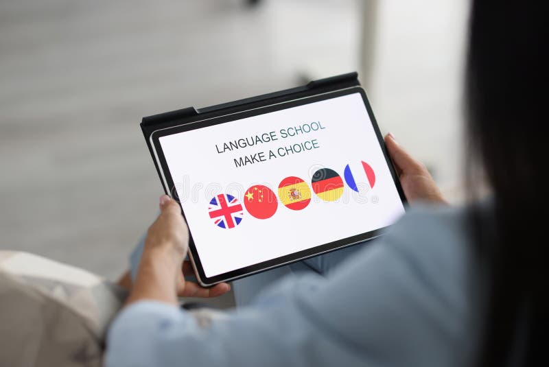 Woman Holds Tablet and Chooses a Foreign Language To Study Stock Photo ...