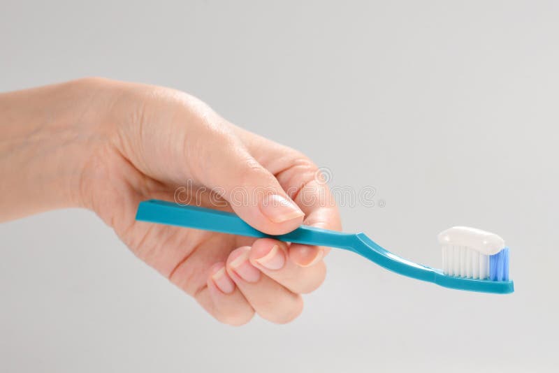 Woman Holds Toothbrush with Toothpaste in Her Hand Isolated on White ...