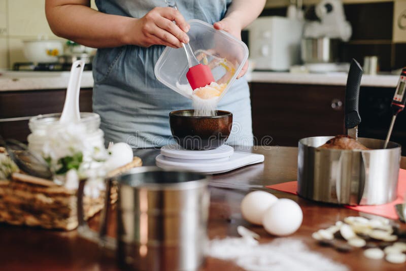 Woman at home baking cake stock photo. Image of cake - 92251514