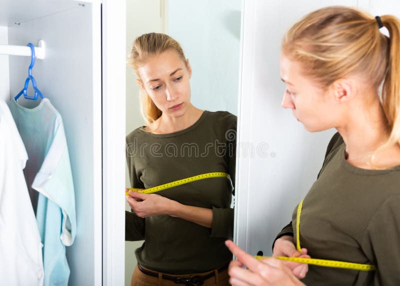 Woman measuring bust line stock photo. Image of buxom - 8457630