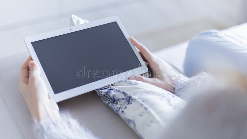 Woman at Home Relaxing Reading on the Tablet Computer Stock Image ...