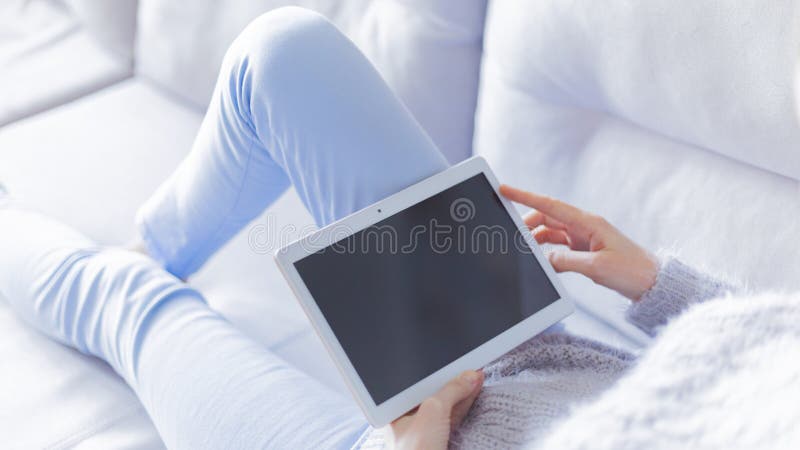 Woman at Home Relaxing Reading on the Tablet Computer Stock Image ...