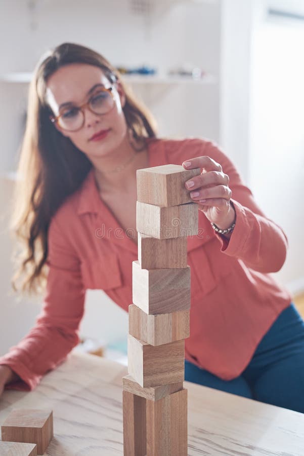 Woman, Home and Serious on Desk with Building Blocks for Problem ...