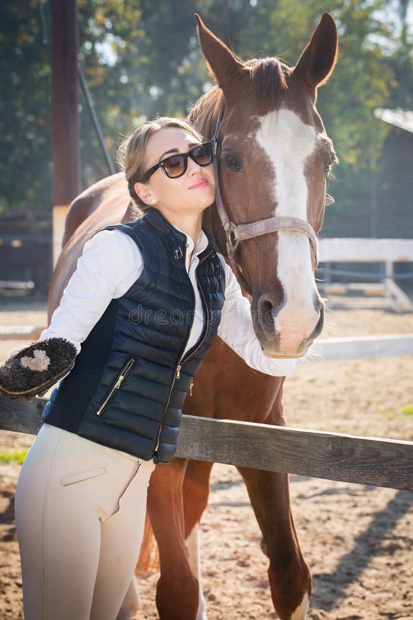 Woman hugging a horse stock image. Image of friendship - 128211243