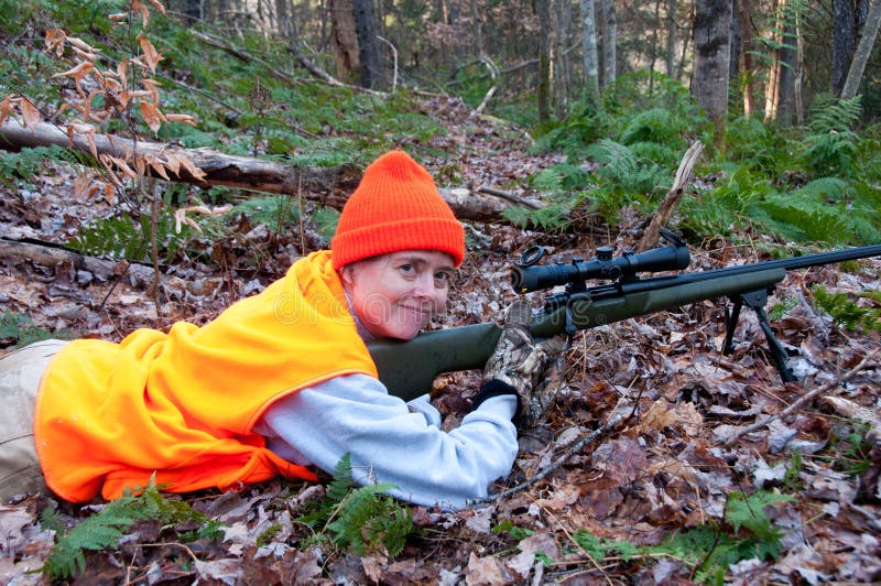 Woman Hunter Smiles with Her Rifle Stock Image - Image of lying, gloves ...
