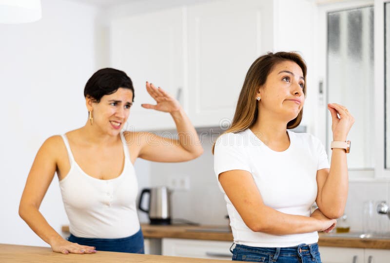 Woman Ignoring Her Girlfriend Standing In Background And Arguing With