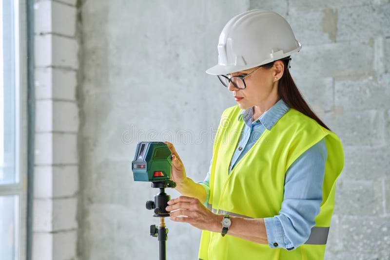 Woman Industrial Worker in Protective Vest Helmet Working on ...
