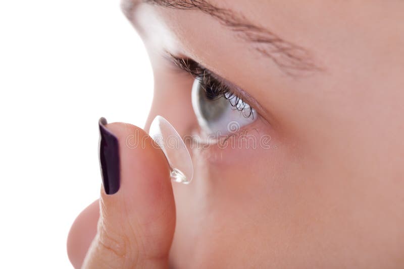 Woman Inserting a Contact Lens Stock Photo - Image of focus, looking ...