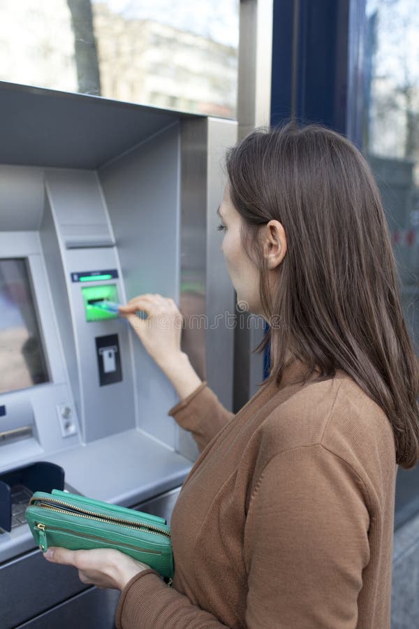 Woman Putting Card into ATM in Spring Stock Photo - Image of standing ...