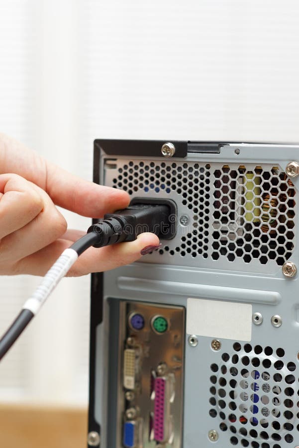Woman Inserts Power Cord into a Computer Stock Image - Image of ...