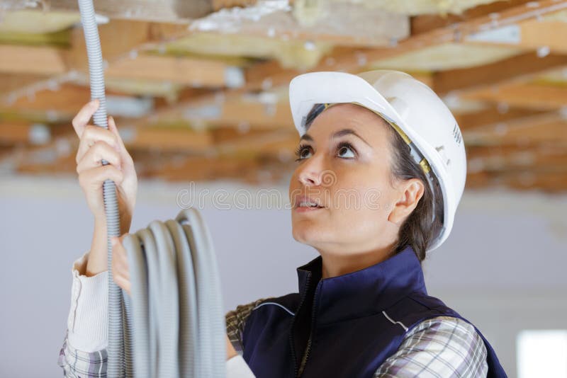 Woman Installing Cable in Renovation Property Stock Image - Image of ...