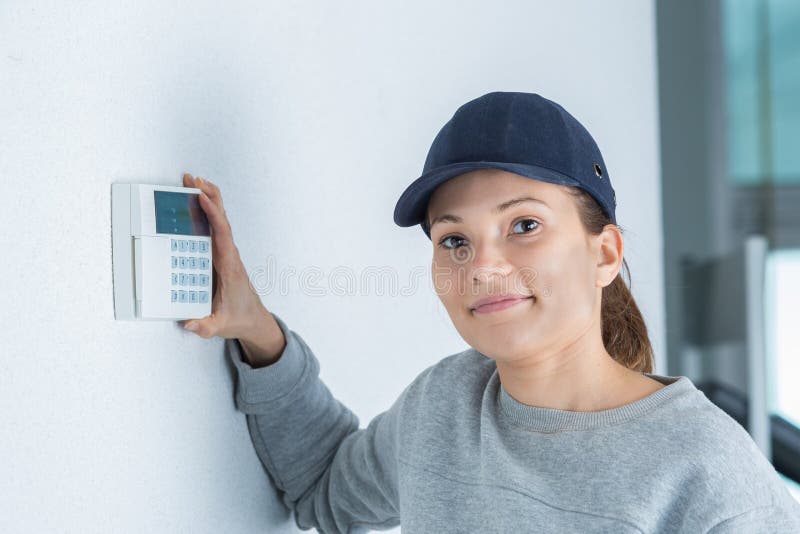 Woman Installing Electronic Lock Stock Photo - Image of technician ...