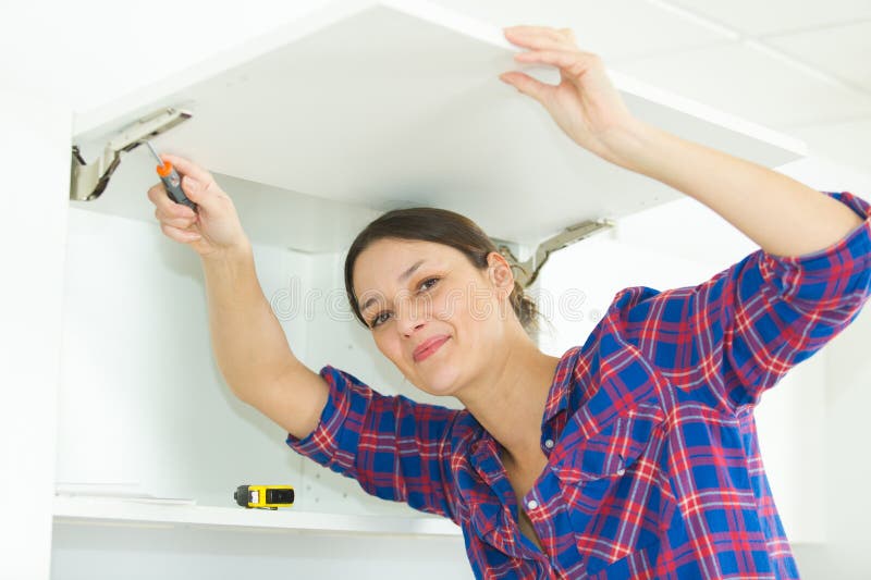 Woman Installing Window Handle with Screwdriver Stock Photo - Image of ...