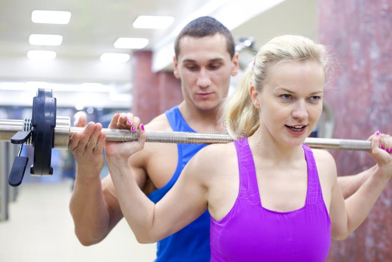 Woman with Instructor in Gym Stock Image - Image of middle, fitness ...
