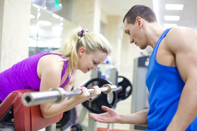 Woman with Instructor in Gym Stock Photo - Image of athletic, muscular ...