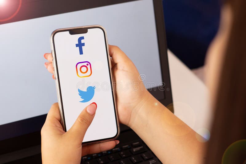 Woman Interacting with the Cell Phone with Facebook, Instagram and ...