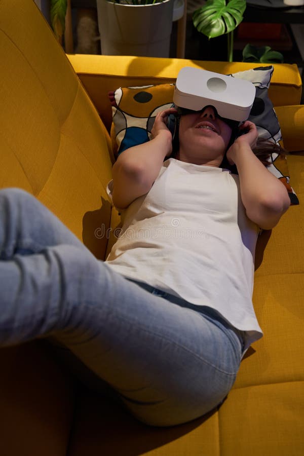 Woman Interacts with Virtual Reality Using a Vr Headset. Stock Image ...