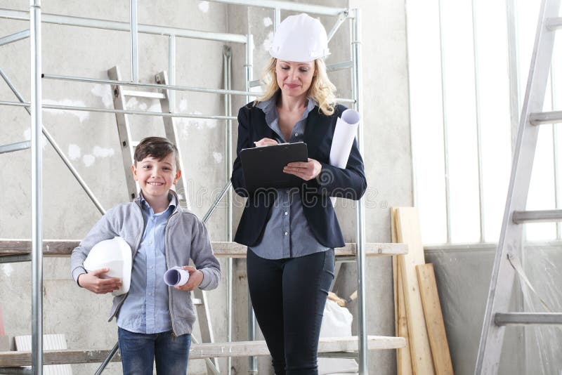 Woman Interior Designer or Architect Mom with Her Son they Work ...