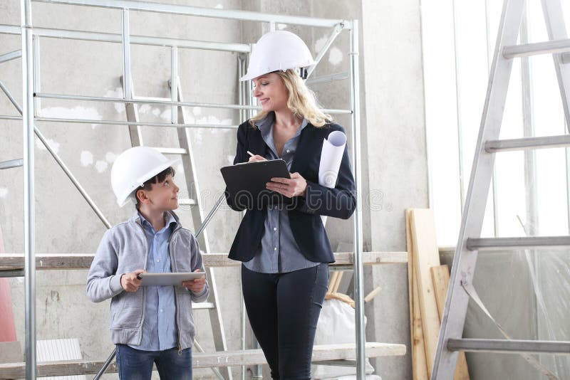 Woman Interior Designer or Architect Mom with Her Son at Work,, they ...