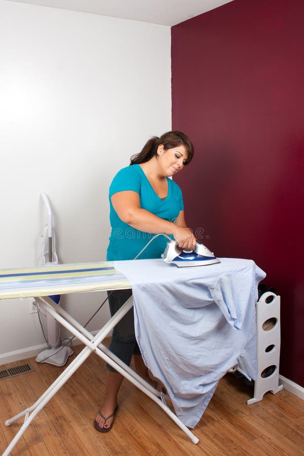 Woman Ironing Clothes stock photo. Image of lady, housewife - 16552300