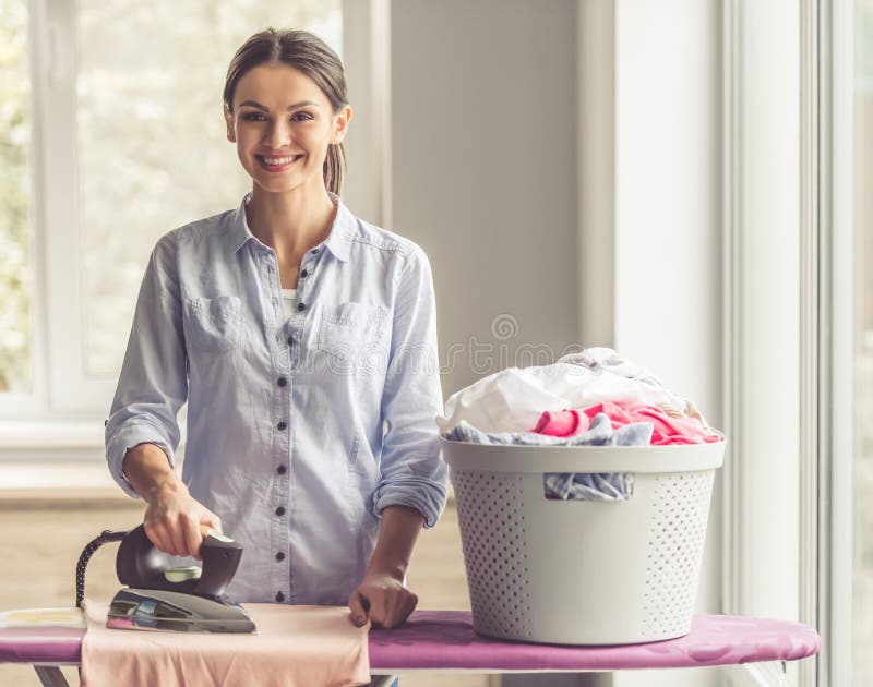 Woman ironing clothes stock photo. Image of ironing, housework - 80187480