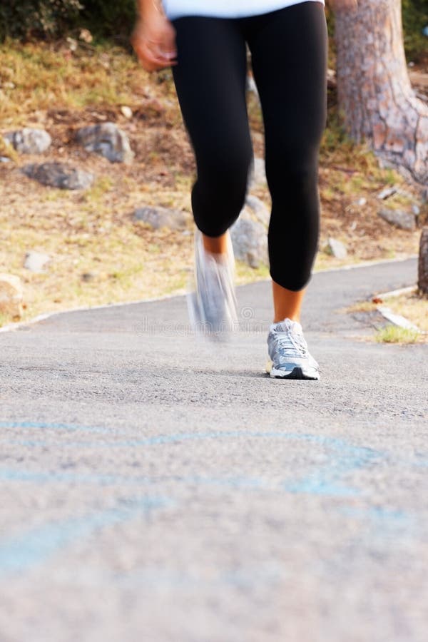 Woman Jogging. Low Section of Woman Jogging on Pathway. Stock Image ...