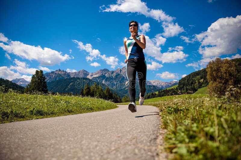 Woman Jogging Outdoors. Italy Dolomites Alps Stock Photo - Image of ...